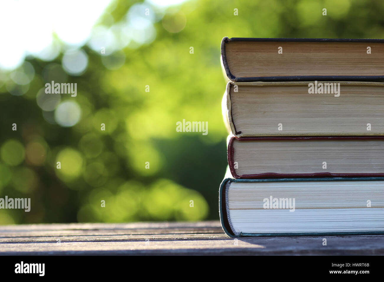 book stack background table wooden outdoor Stock Photo - Alamy