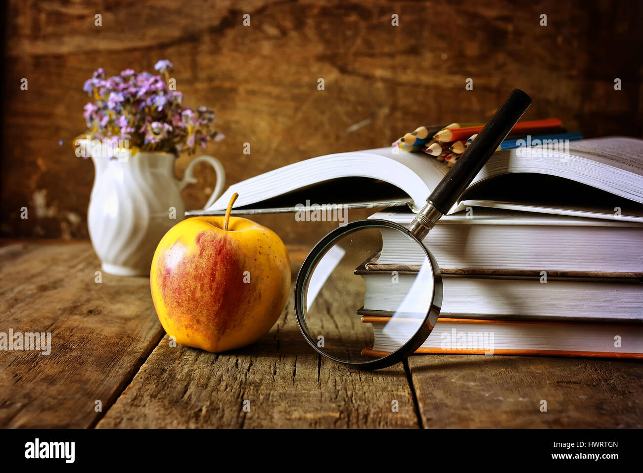 magnifying glass education book Stock Photo - Alamy
