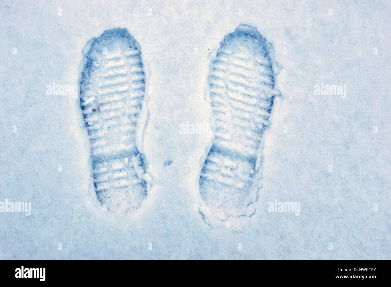 foot steps on snow ground Stock Photo - Alamy