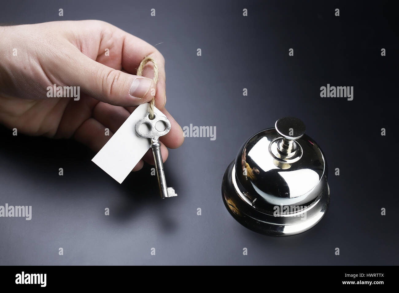 bell and the key at the reception in the hotel Stock Photo - Alamy