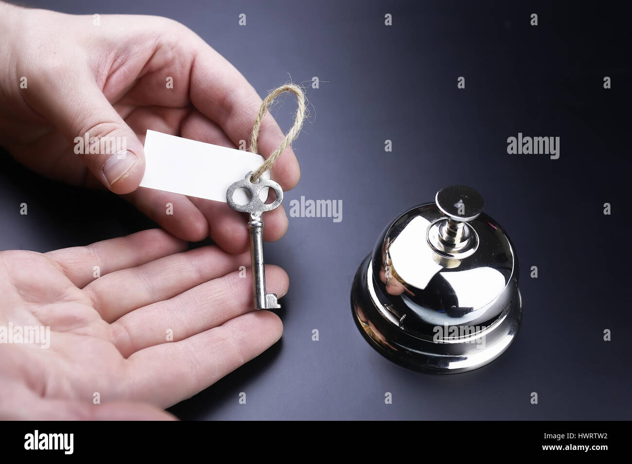 bell and the key at the reception in the hotel Stock Photo - Alamy