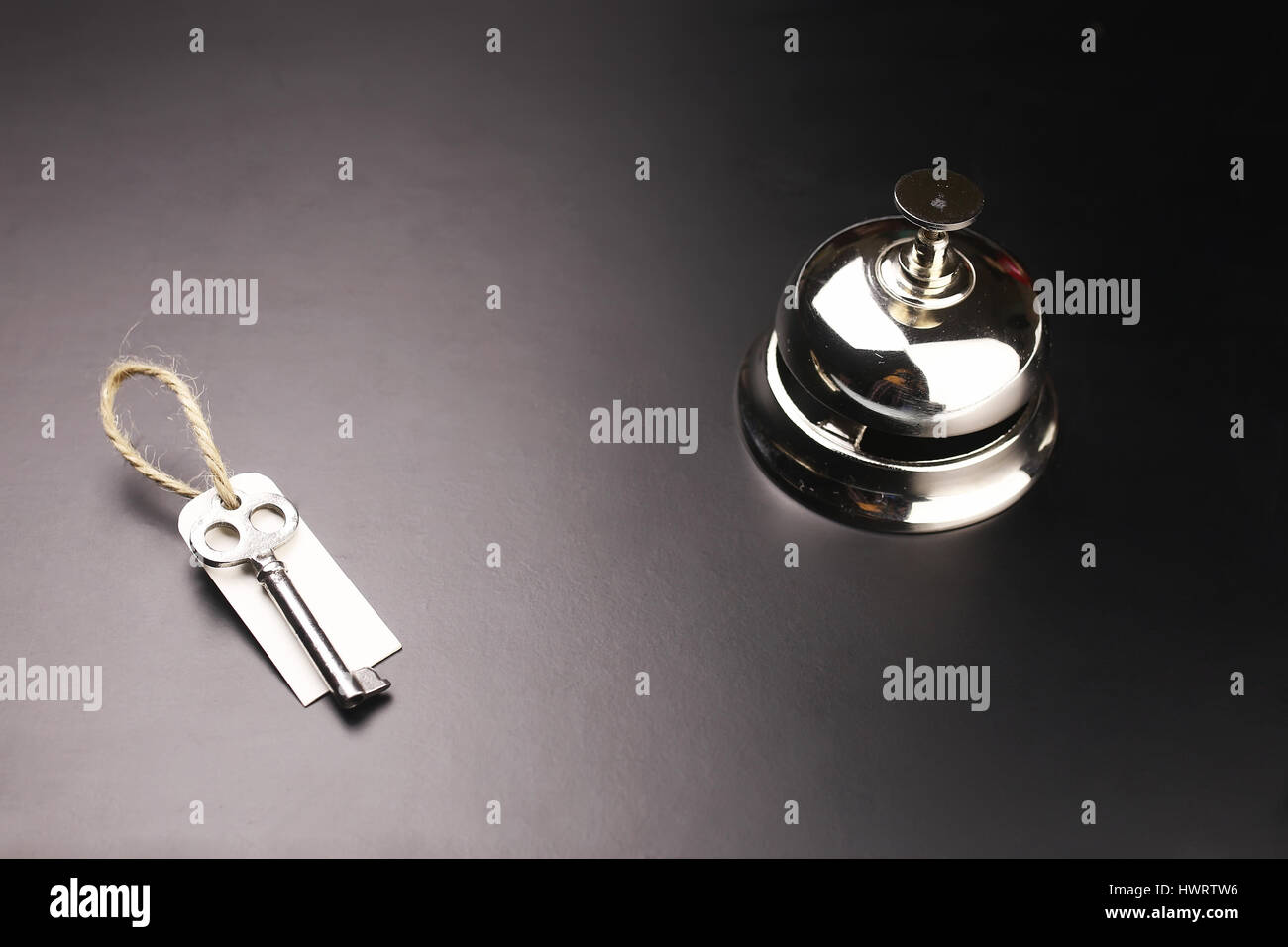 bell and the key at the reception in the hotel Stock Photo - Alamy