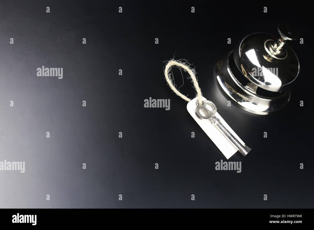 bell and the key at the reception in the hotel Stock Photo - Alamy