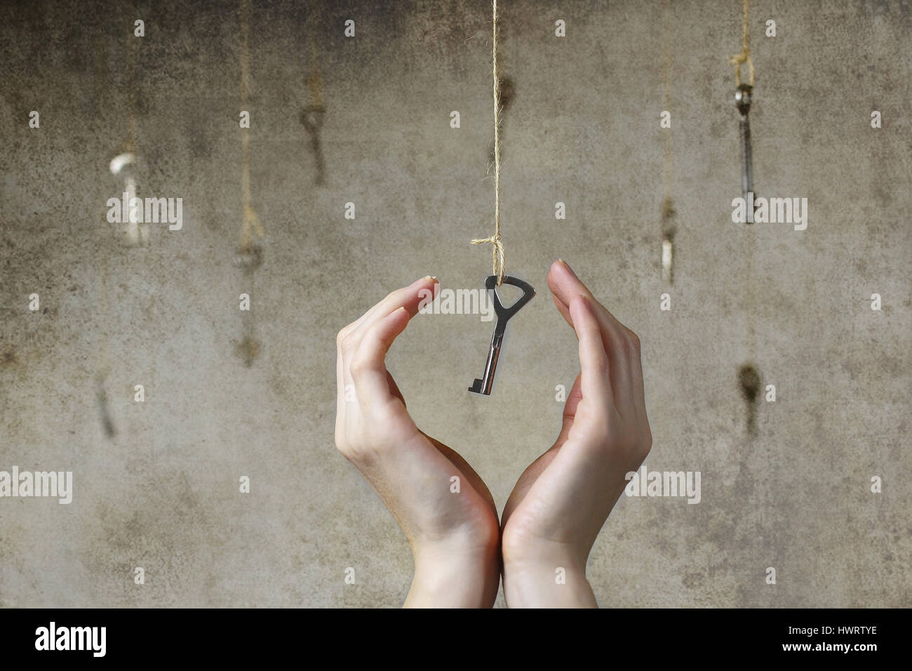 hand stretching for one of the many old vintage keys Stock Photo - Alamy