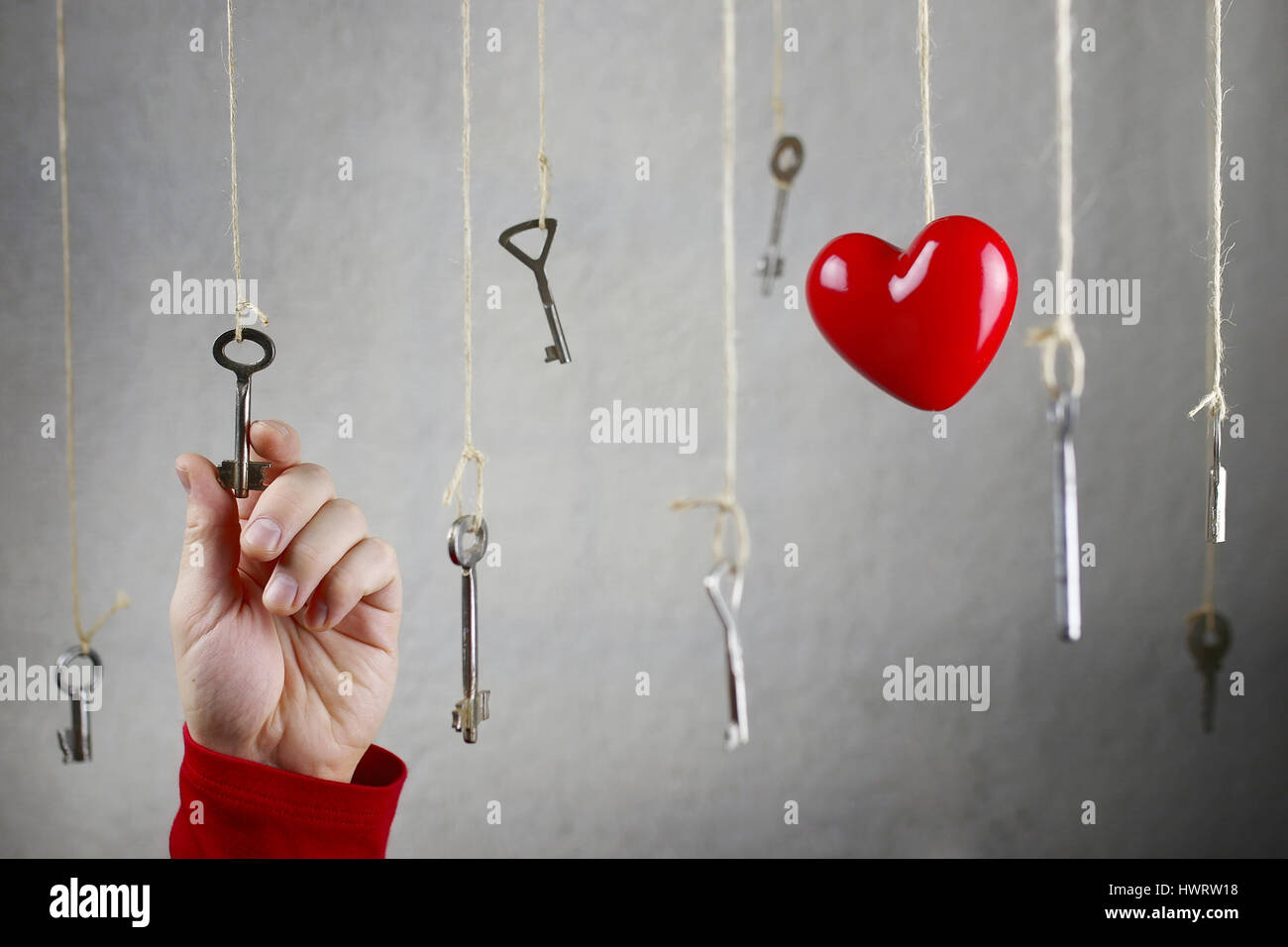 hand stretching for one of the many old vintage keys Stock Photo - Alamy