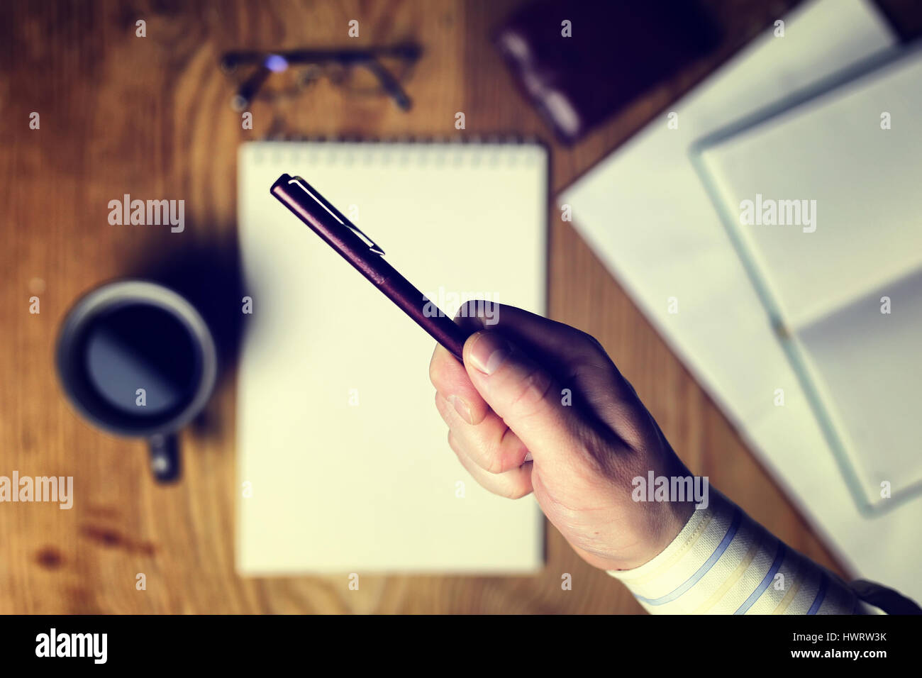 toned table write hand top view Stock Photo - Alamy