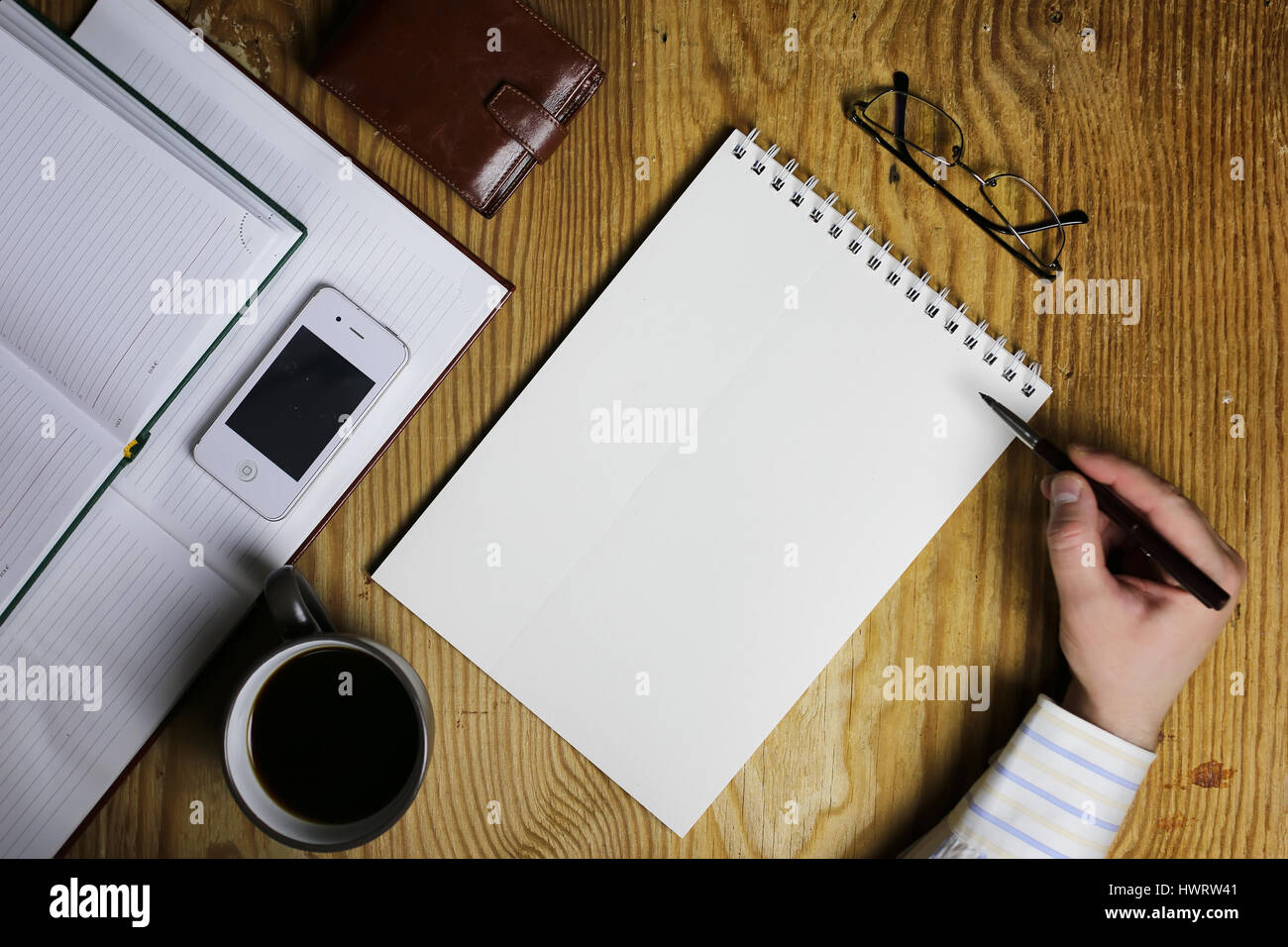 table write hand office view Stock Photo - Alamy
