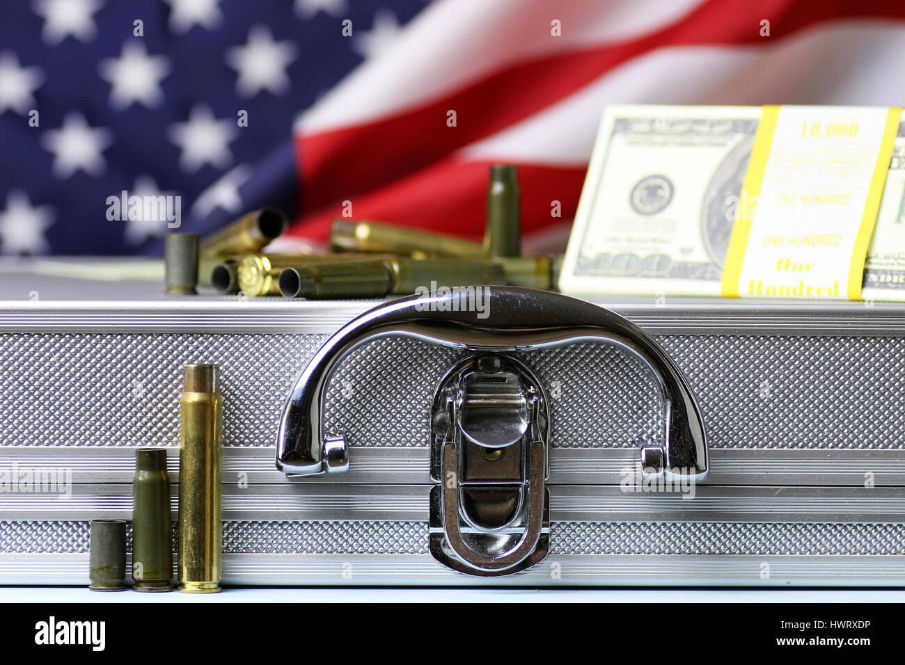 bullet and money dollar on the silver case Stock Photo - Alamy