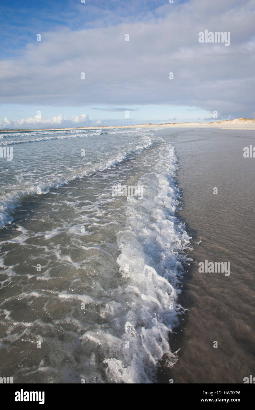 Waves breaking on beautiful remote beach Stock Photo - Alamy