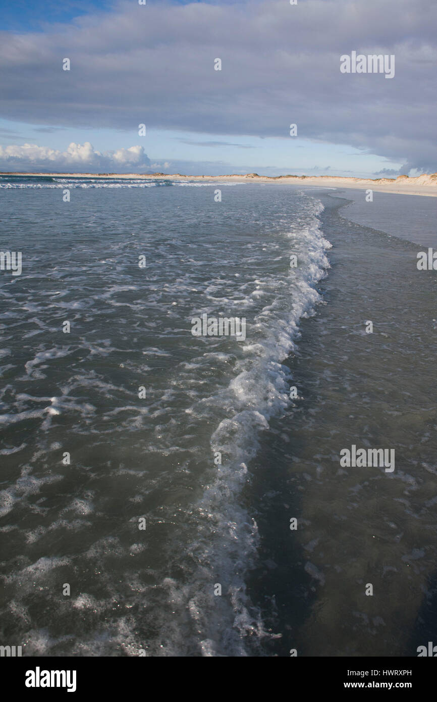 Waves breaking on beautiful remote beach Stock Photo - Alamy