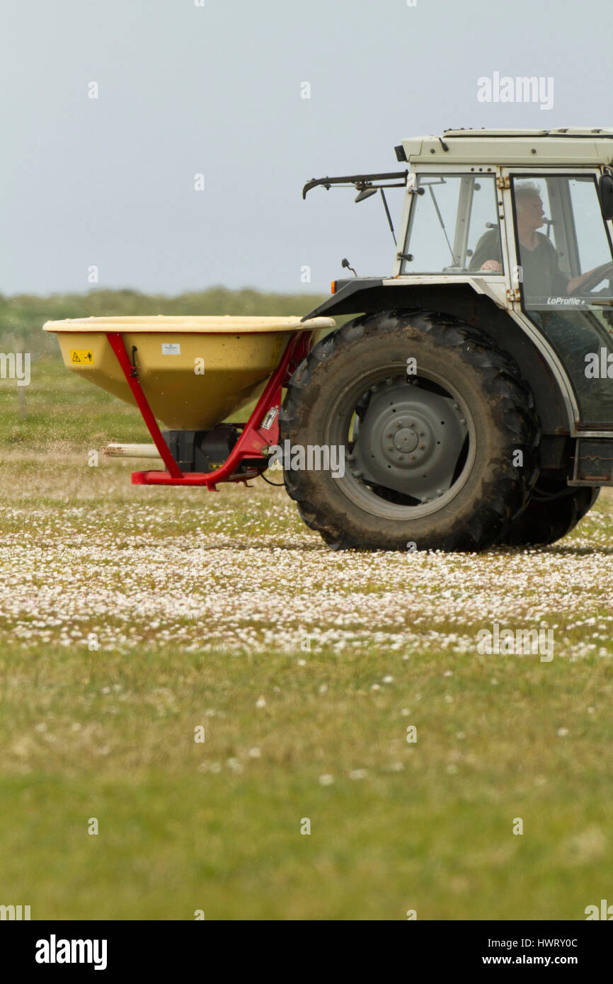 Machir being fertilized to improve it for agricultural production by ...