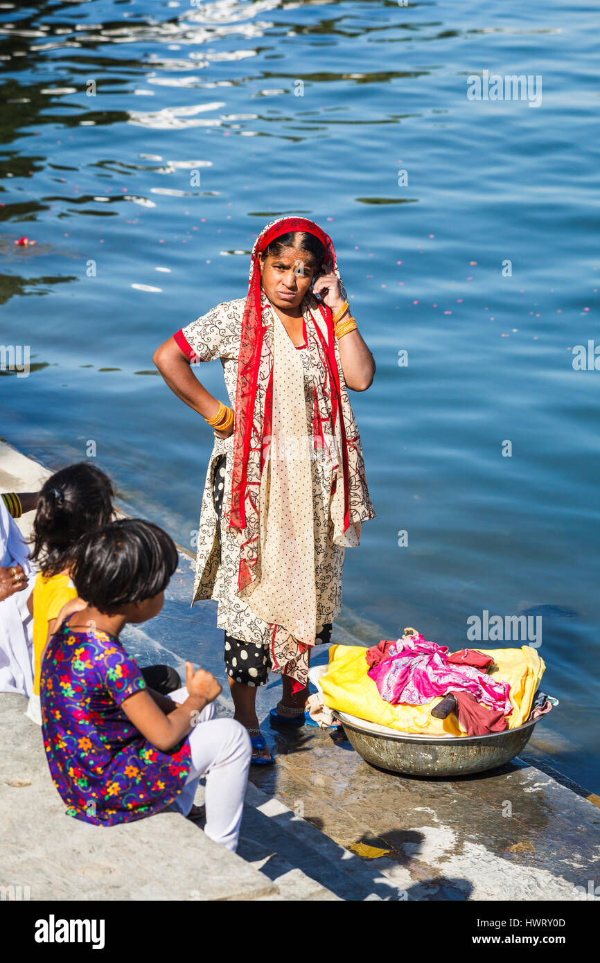 Indian woman washing clothes outside hi-res stock photography and ...