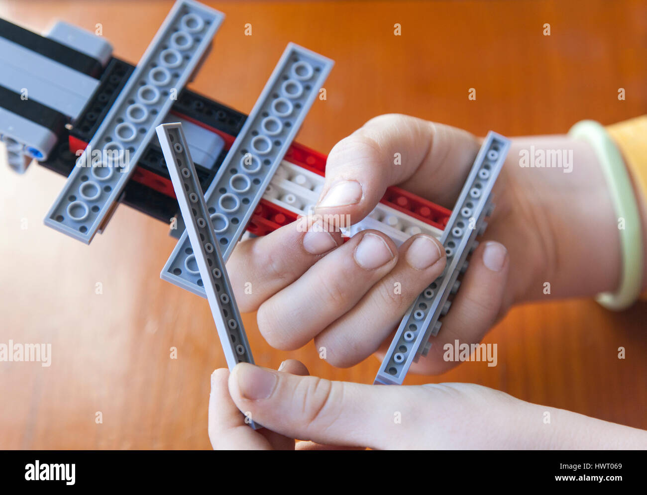 Boys hands playing with construction blocks Stock Photo - Alamy
