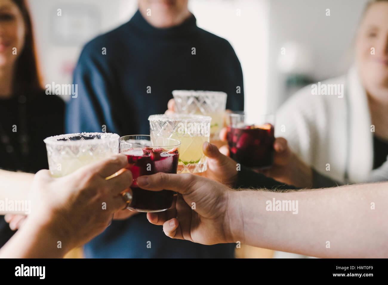 Friends toasting drinks home hi-res stock photography and images - Alamy