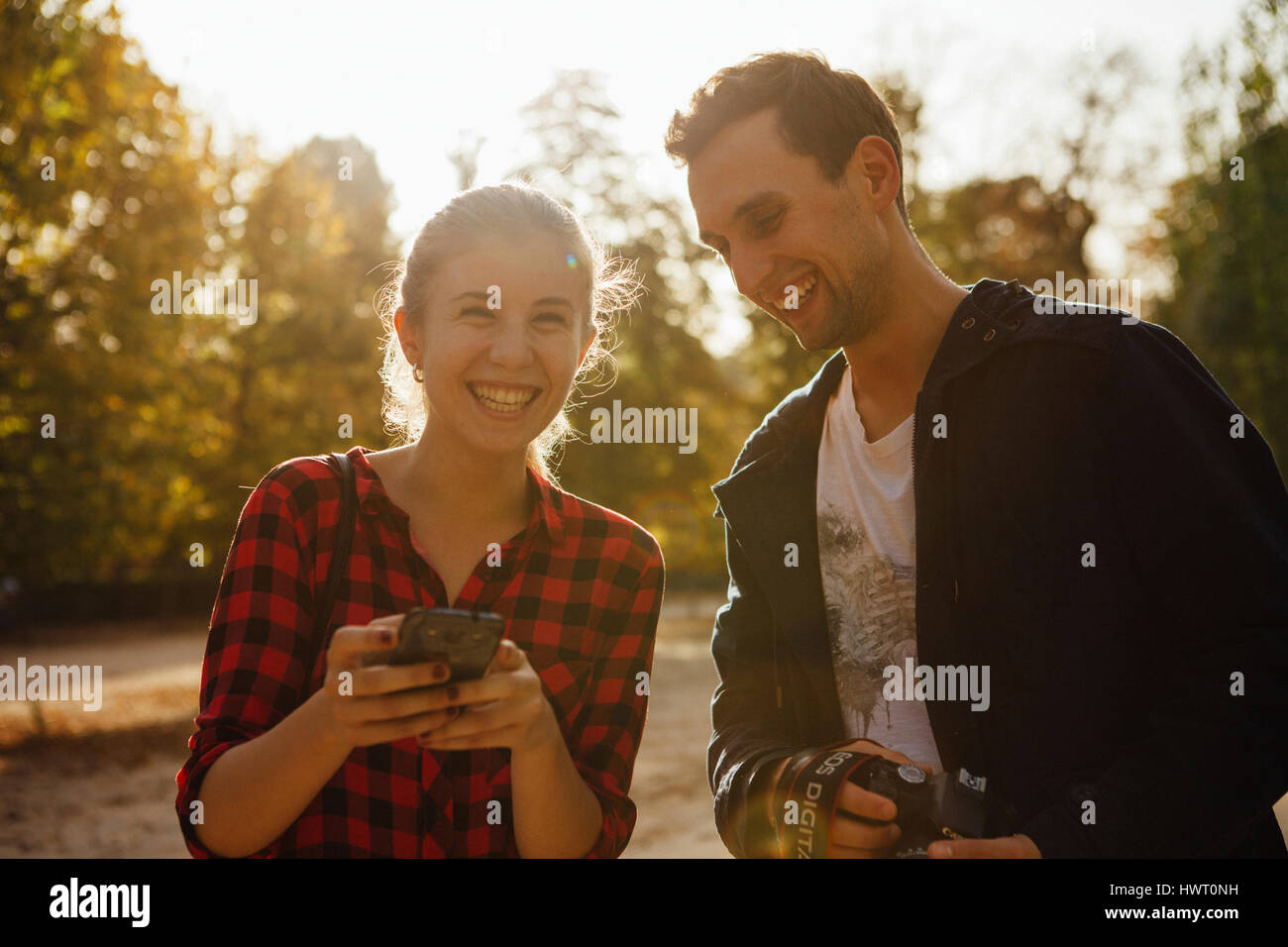 Cheerful female friends using hi-res stock photography and images - Alamy