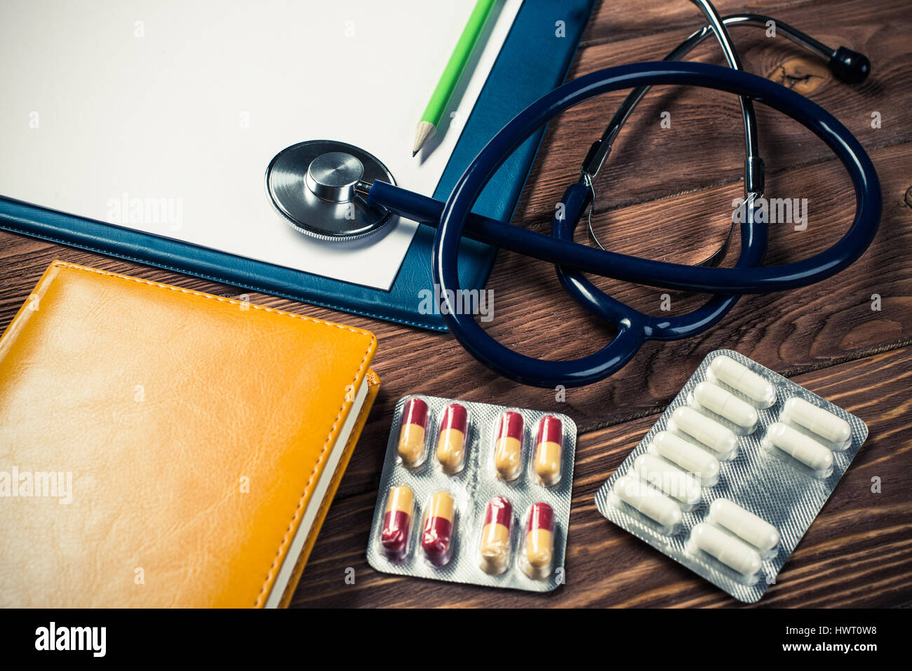 Desk of doctor with medicine things Stock Photo - Alamy