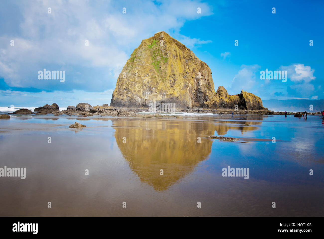 Haystack rock in sea against sky Stock Photo - Alamy