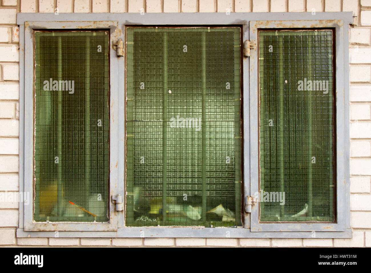 Grating window in the wall in a brick wall Stock Photo - Alamy