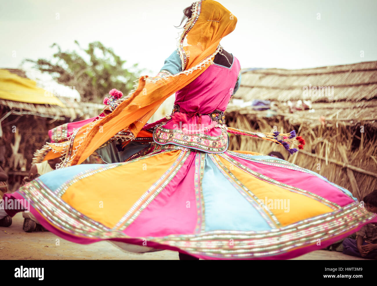 Woman in traditional clothing dancing on field Stock Photo - Alamy