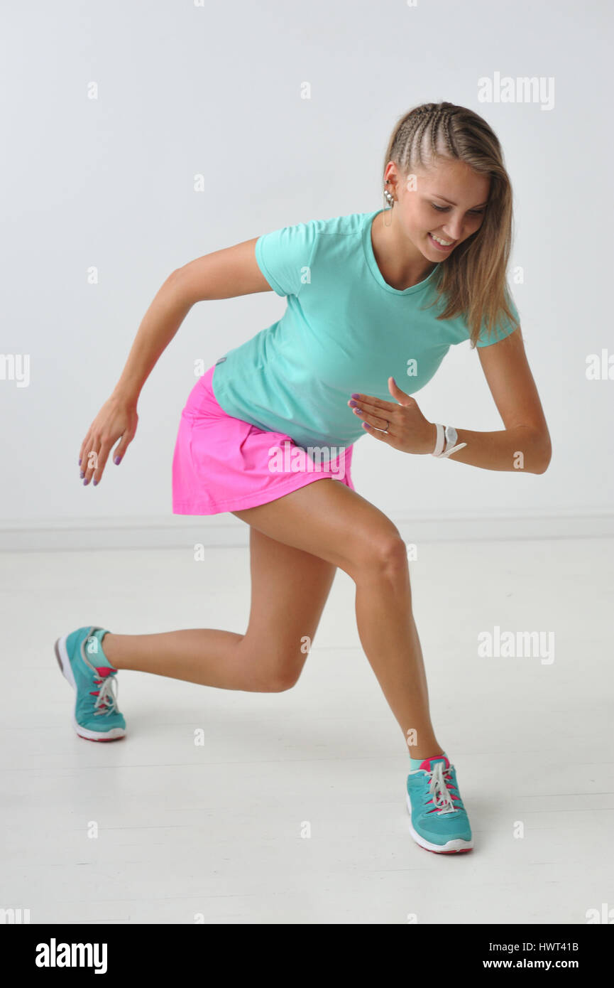 Young and beautiful fitness instructor doing exercises in class Stock ...