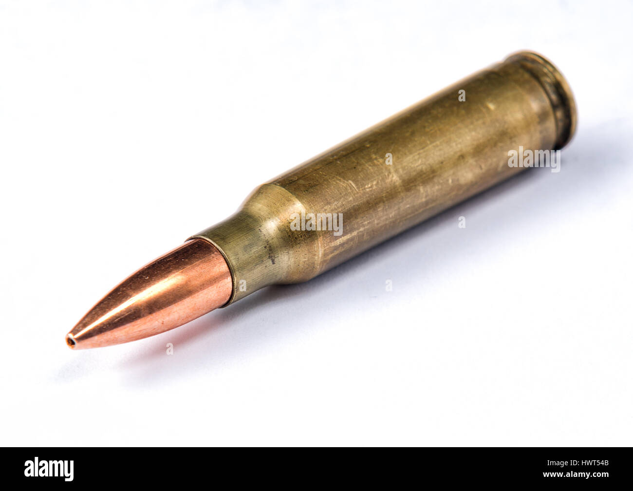 single rifle cartridges with reflections on a white background Stock ...