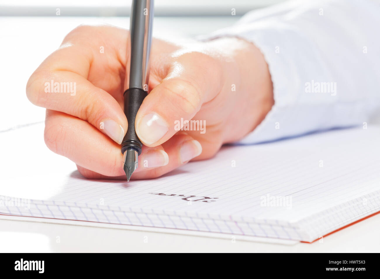Hand making notes with metallic fountain pen Stock Photo - Alamy