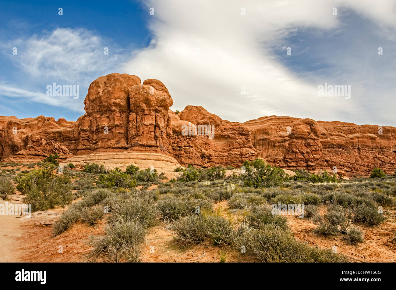 Beautiful red sandstone rock formations are highlighted by interesting ...