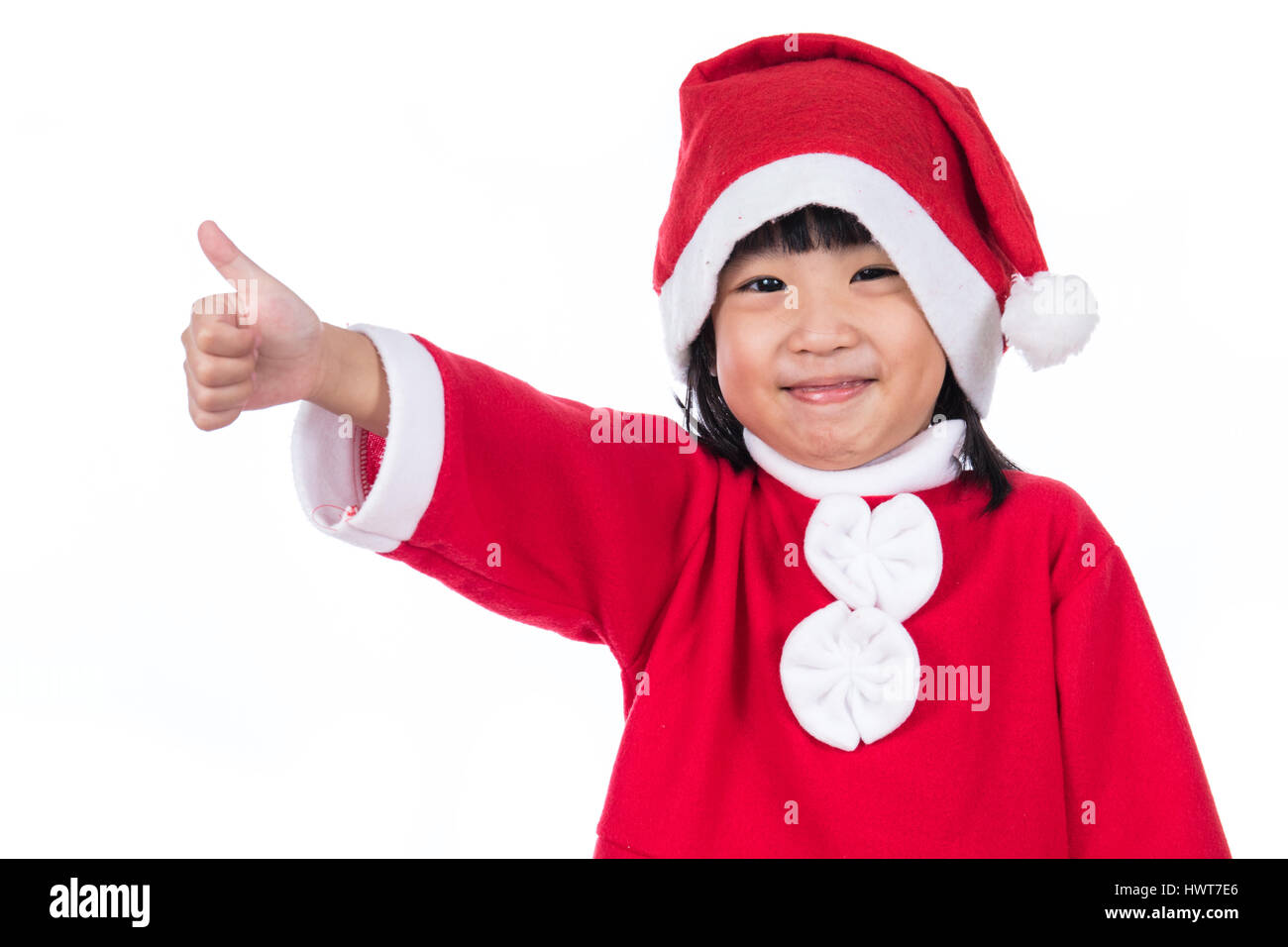 Happy Asian Chinese little santa claus girl with thumbs up in isolated ...