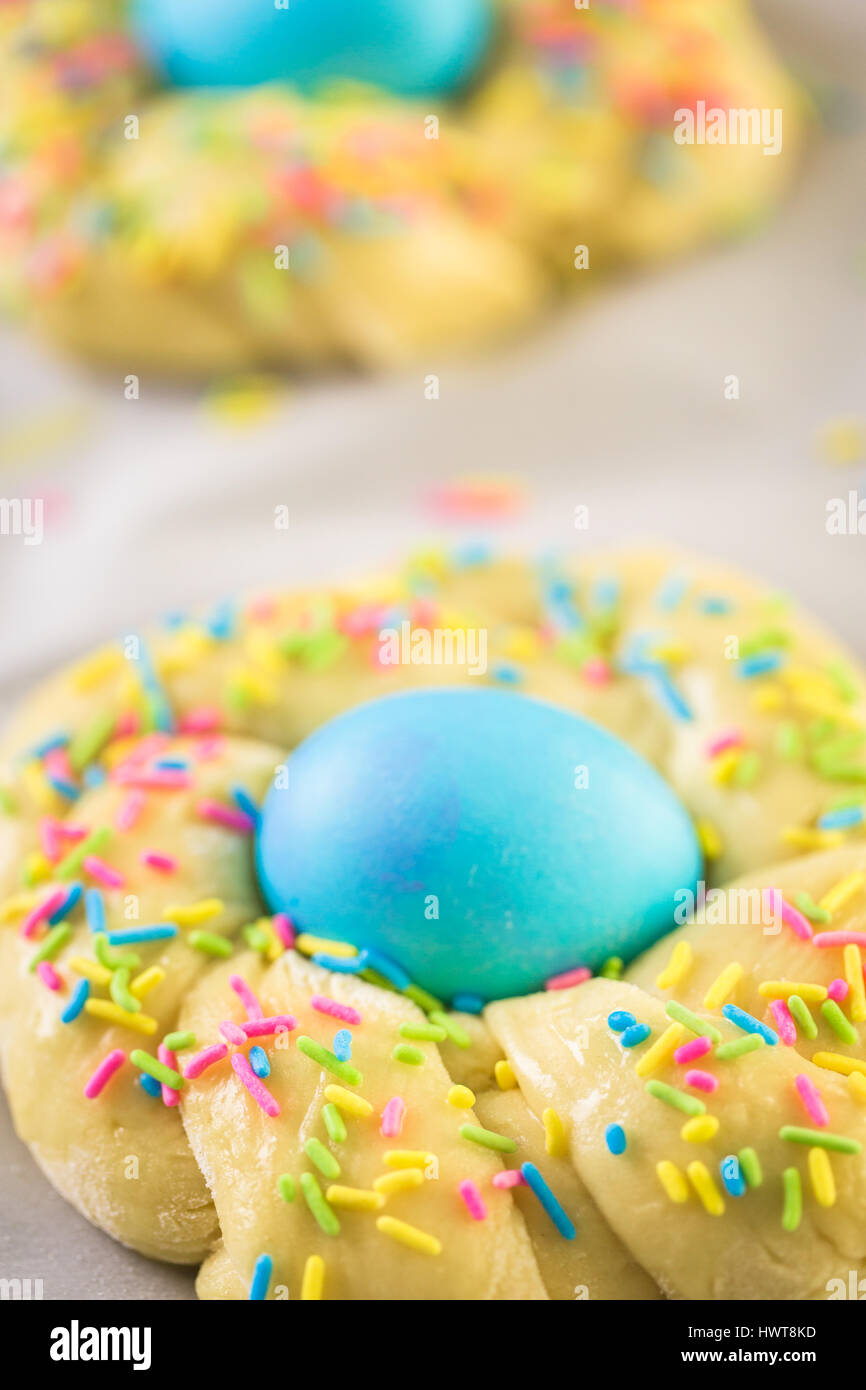 Italian Easter bread with blue colored egg and sprinkles Stock Photo ...