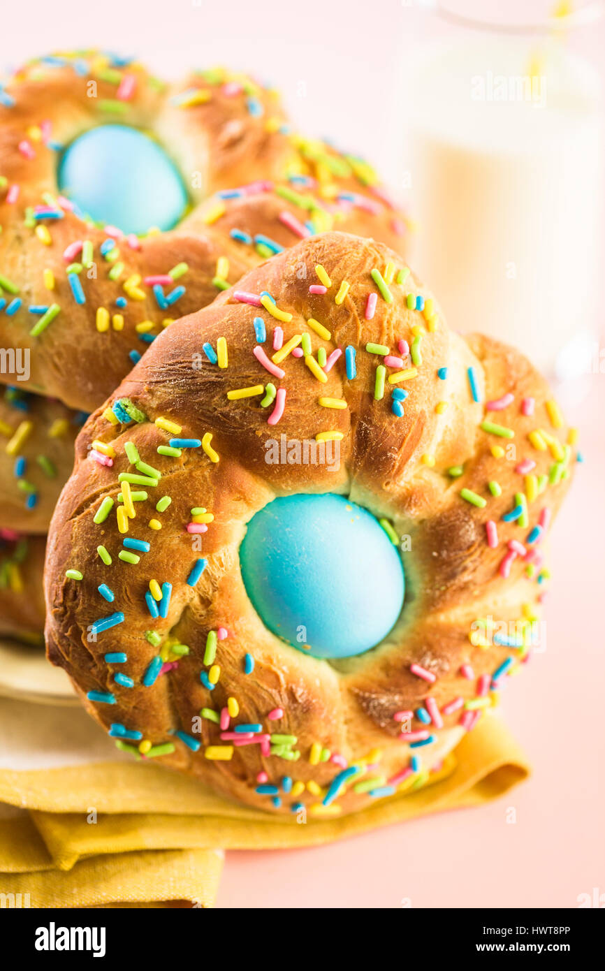 Italian Easter bread with blue colored egg and sprinkles Stock Photo ...