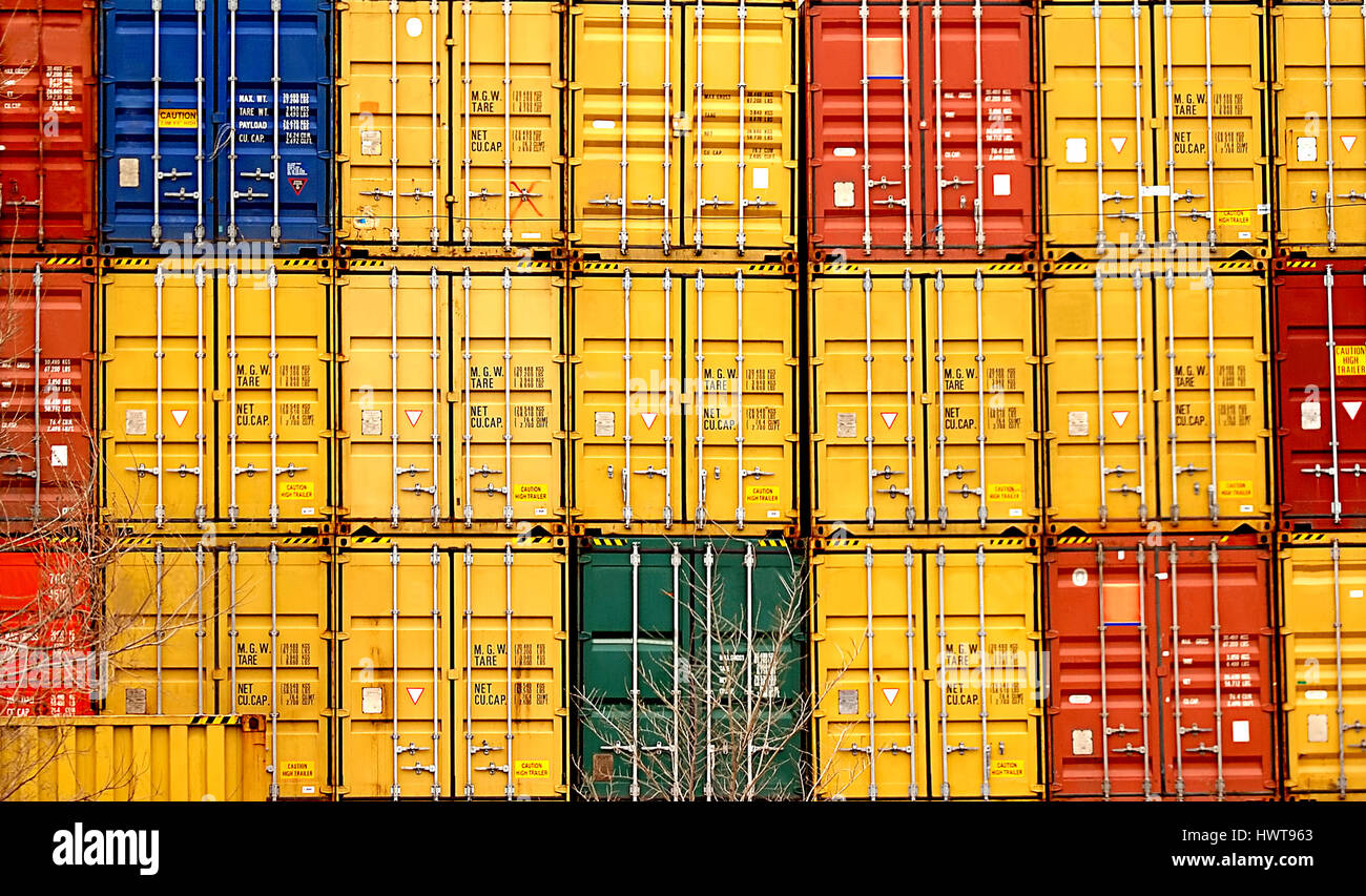 Stacks of shipping containers in port yard Stock Photo - Alamy