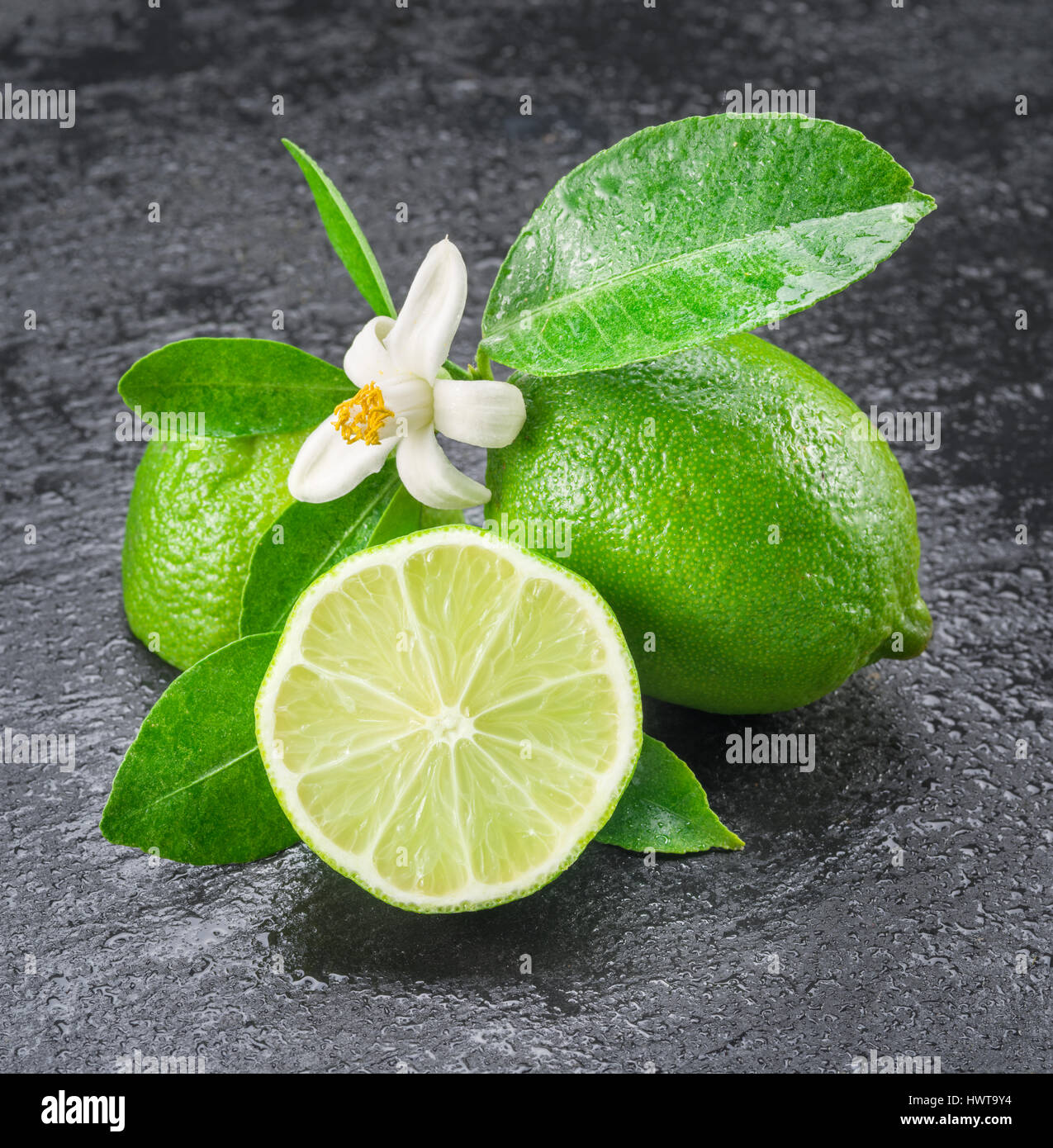 Ripe lime fruits on the gray background Stock Photo - Alamy