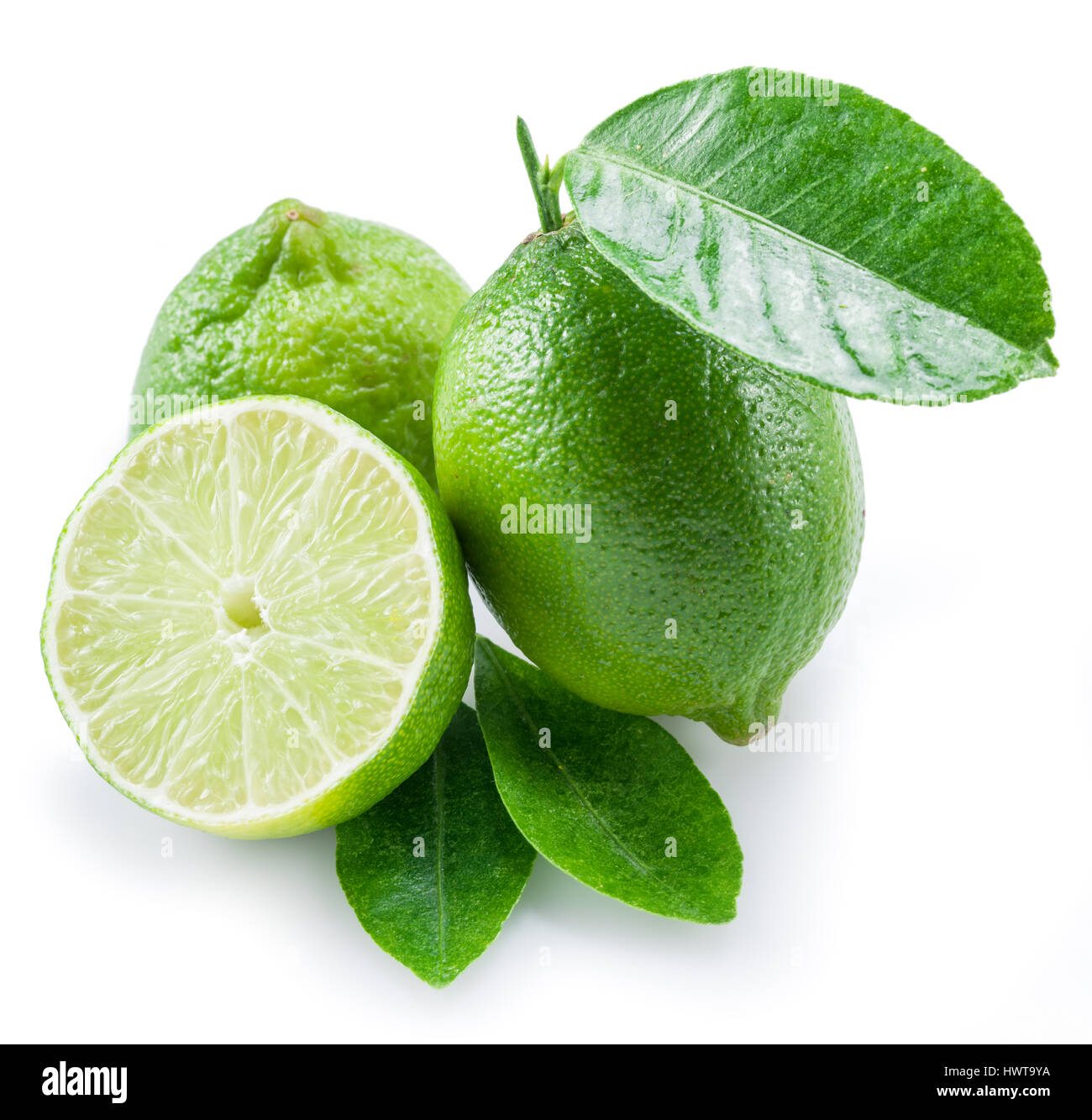 Ripe lime fruits on the white background Stock Photo - Alamy