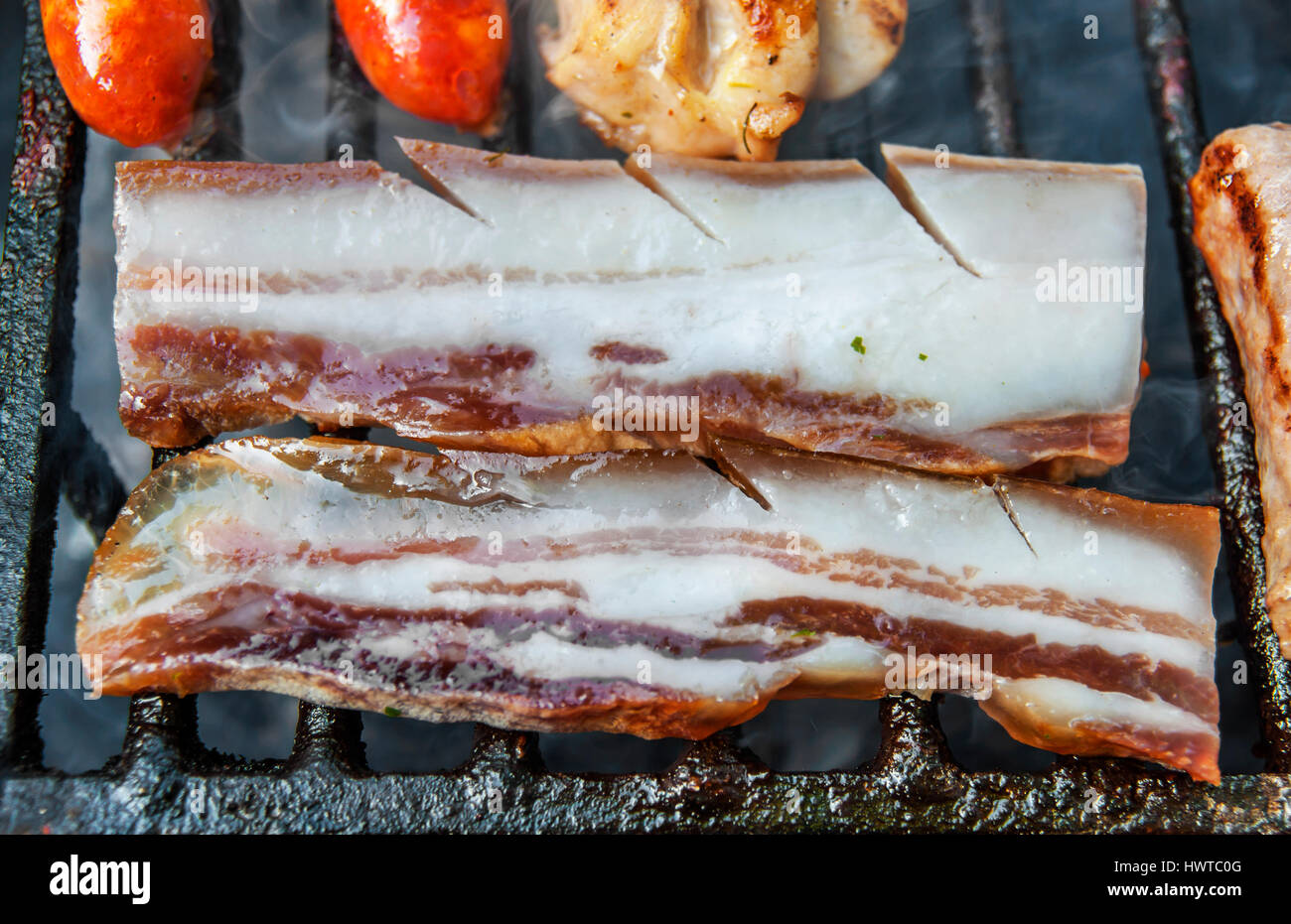 Bacon sliced grilling on hot pan Stock Photo - Alamy