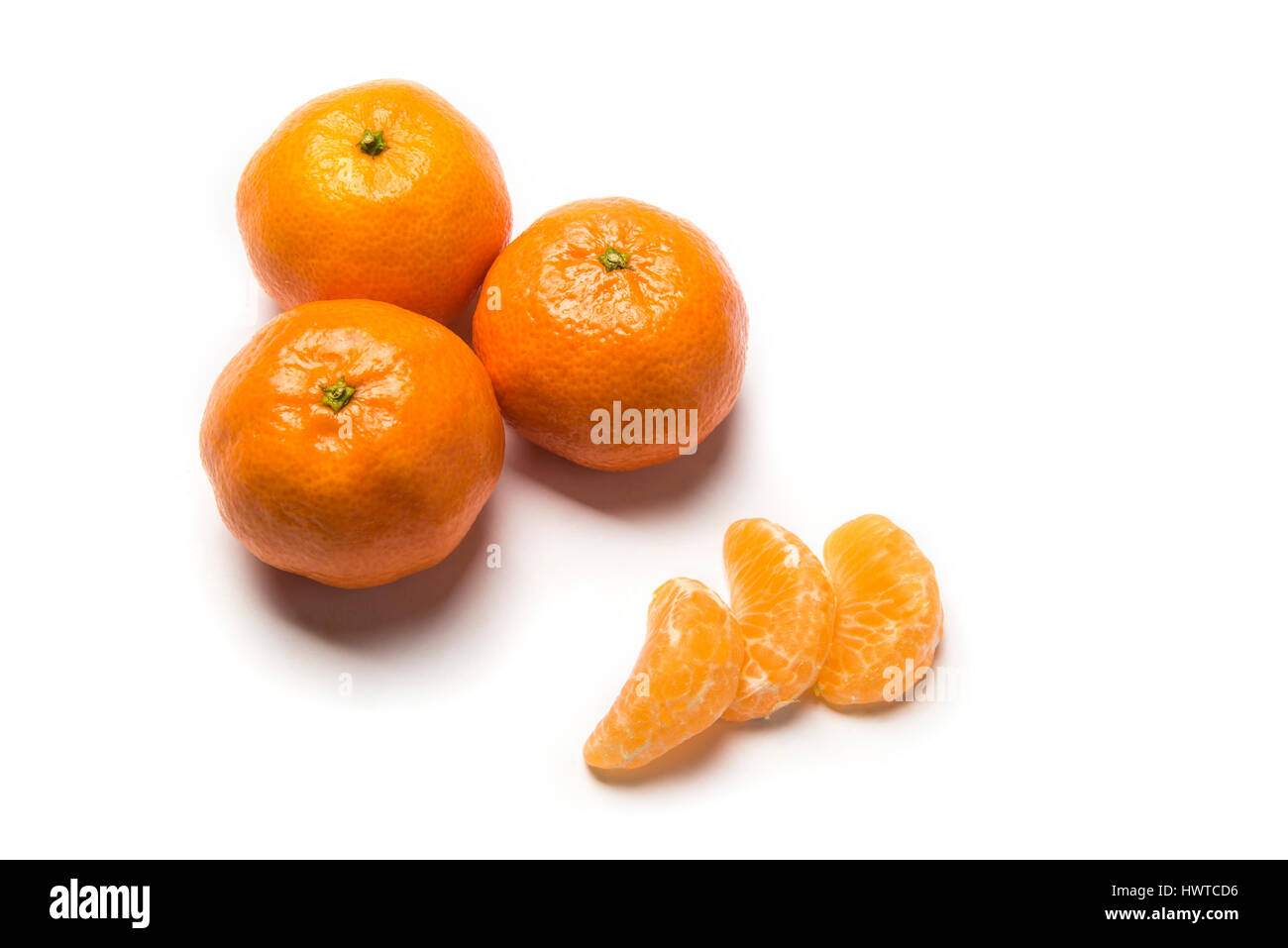 piece of fruit of tangerine with leaves and guys Stock Photo - Alamy