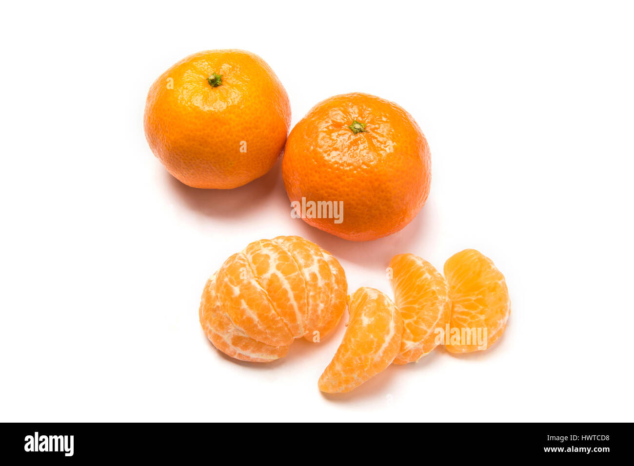 piece of fruit of tangerine with leaves and guys Stock Photo - Alamy