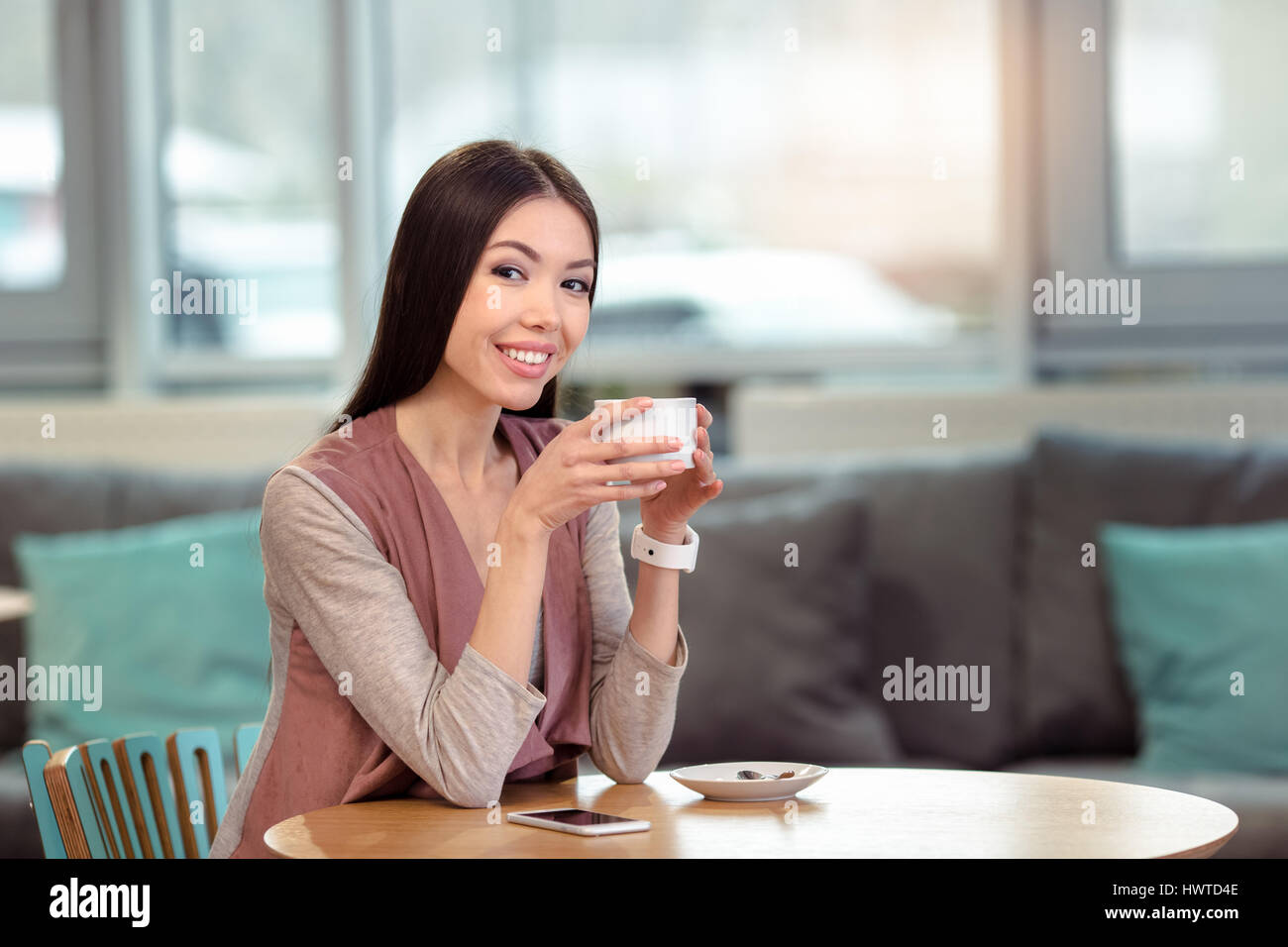 Young beautiful woman in cafe Stock Photo - Alamy