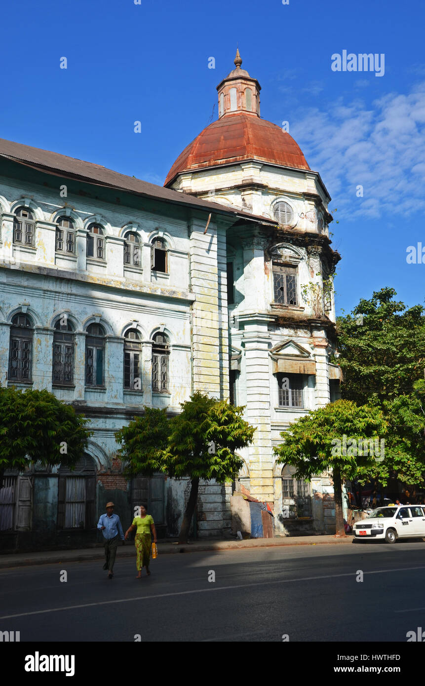 A couple crosses the road outside the Yangon Division Court building on ...