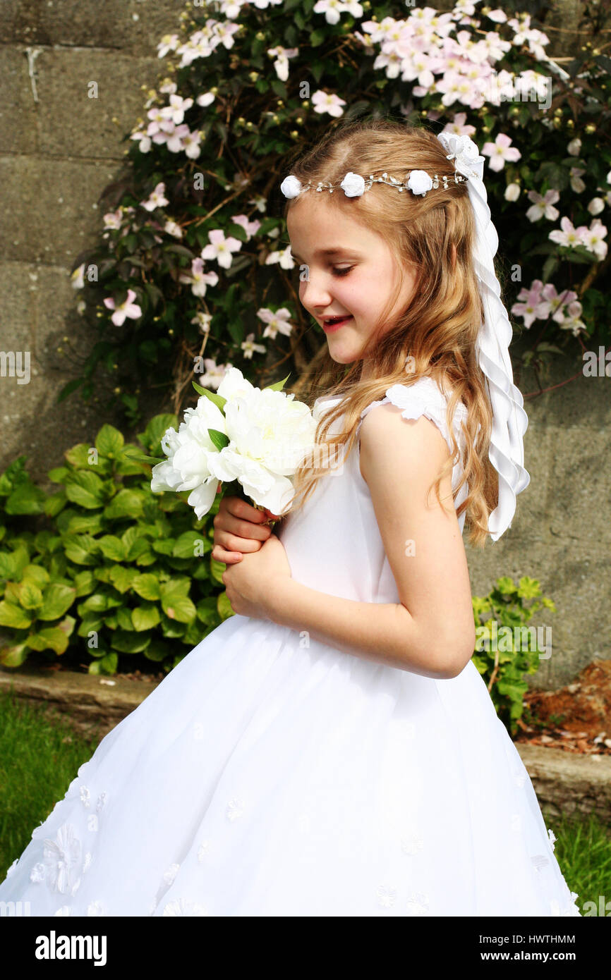 First Holy Communion girl in the garden, first communion Stock Photo ...