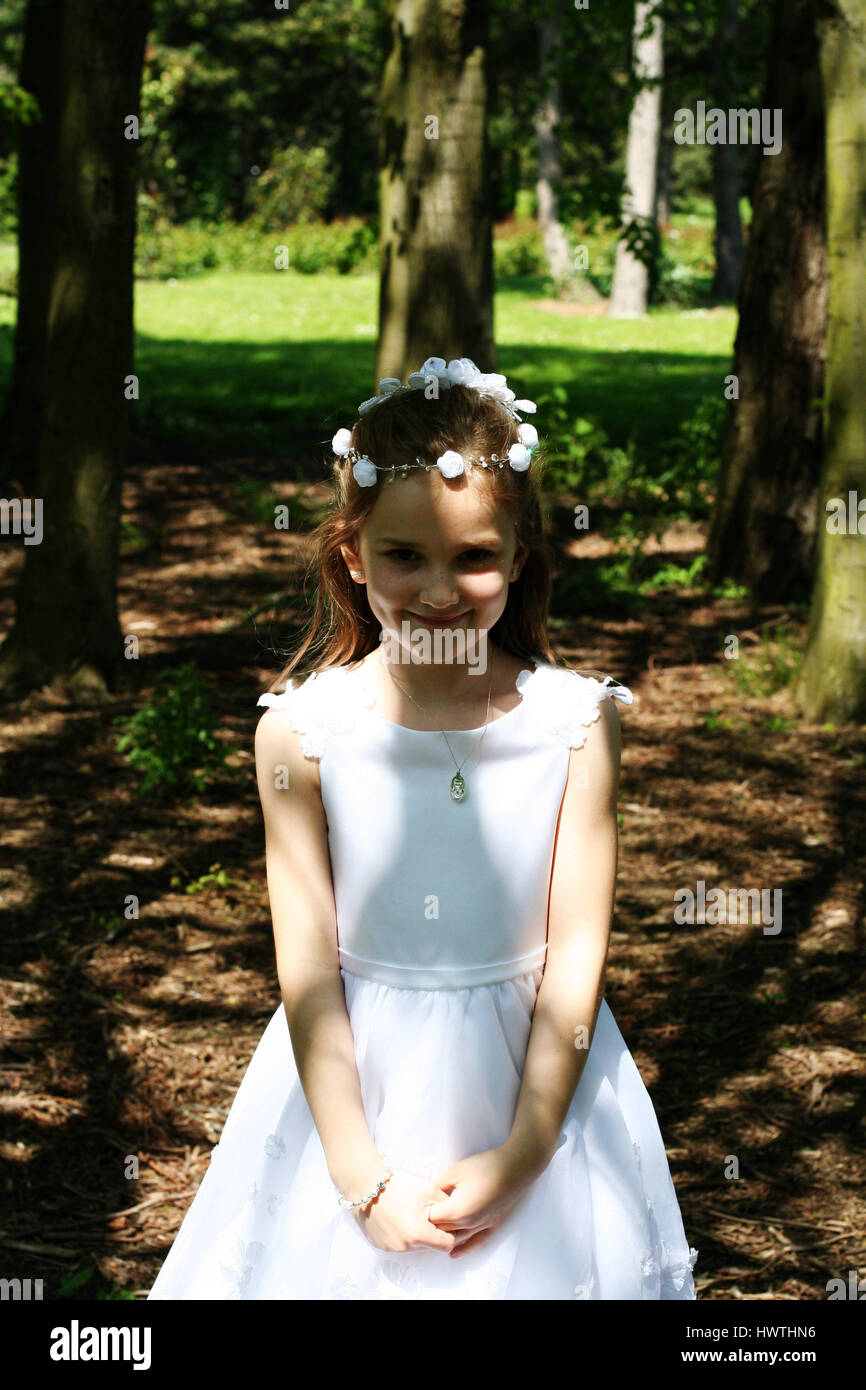 Communion girl in the garden Stock Photo - Alamy