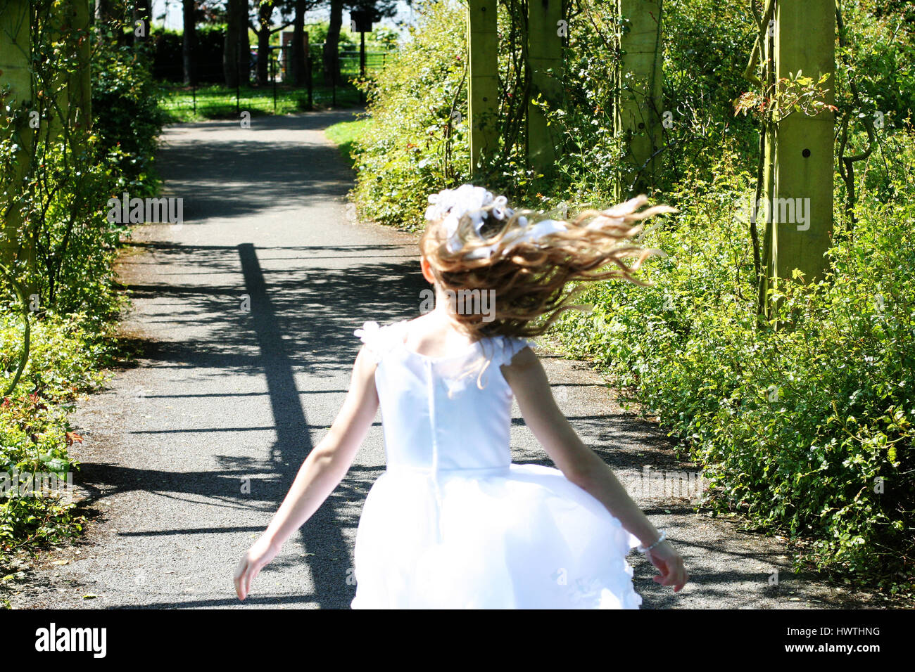 Communion girl in the garden Stock Photo - Alamy