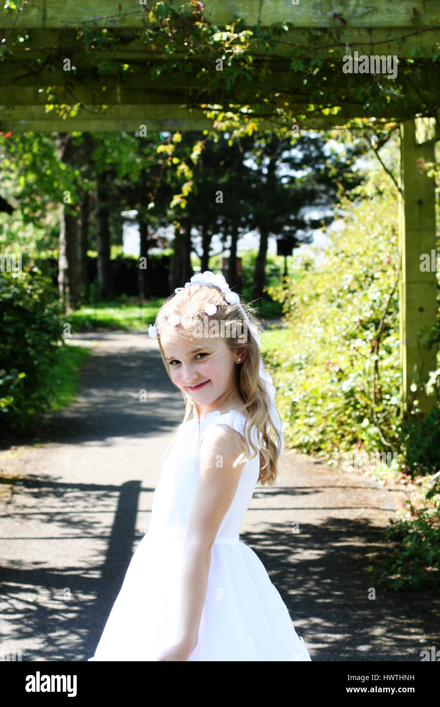 Communion girl in the garden Stock Photo - Alamy