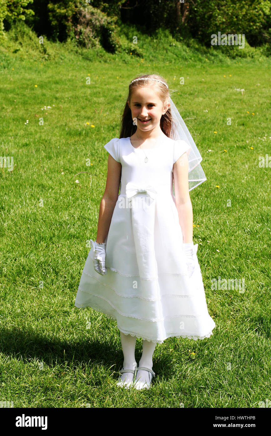 First Holy Communion girl in the garden, first communion Stock Photo ...