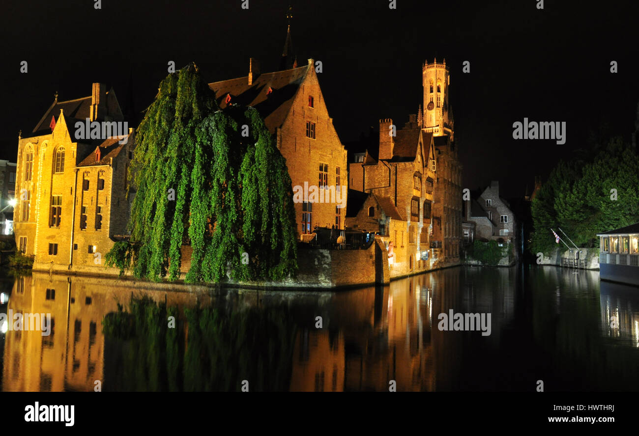 beautiful Brugge night view with canal reflections of buildings and ...