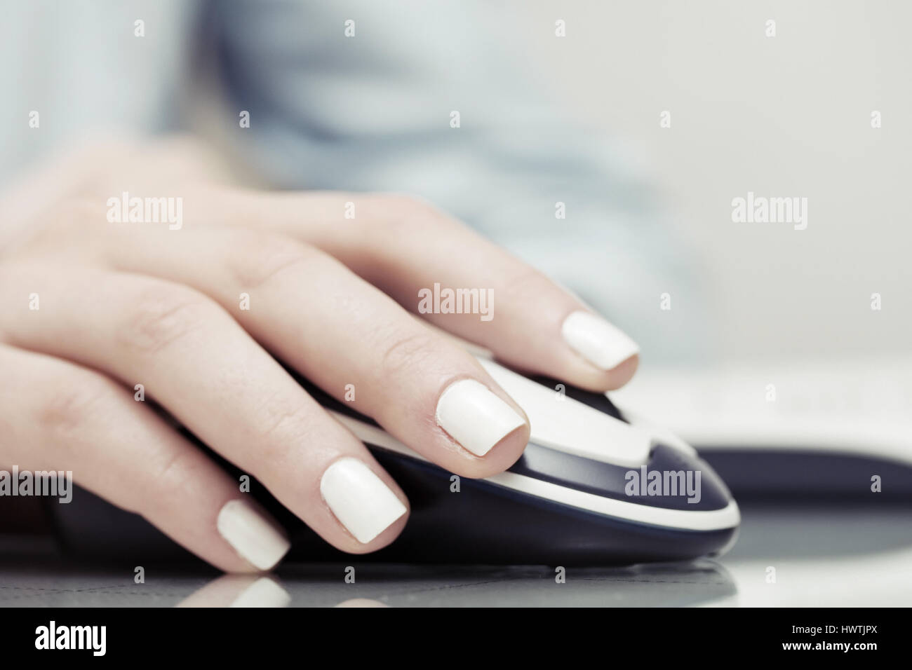 Female hand using computer mouse Stock Photo - Alamy