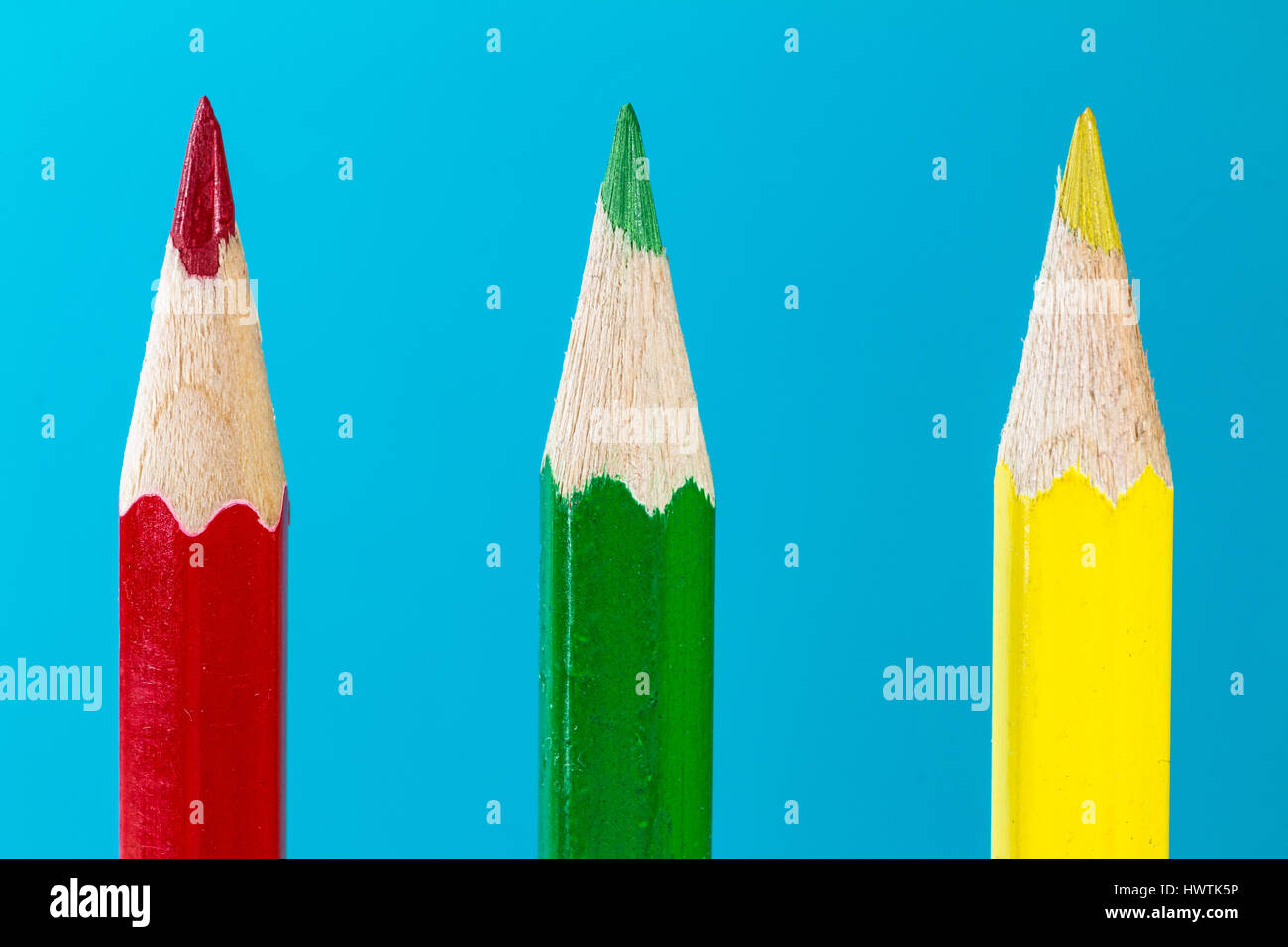 three colored pencils Stock Photo - Alamy