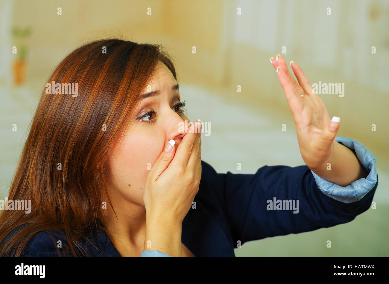 Surprised girl wearing ring on finger Stock Photo - Alamy