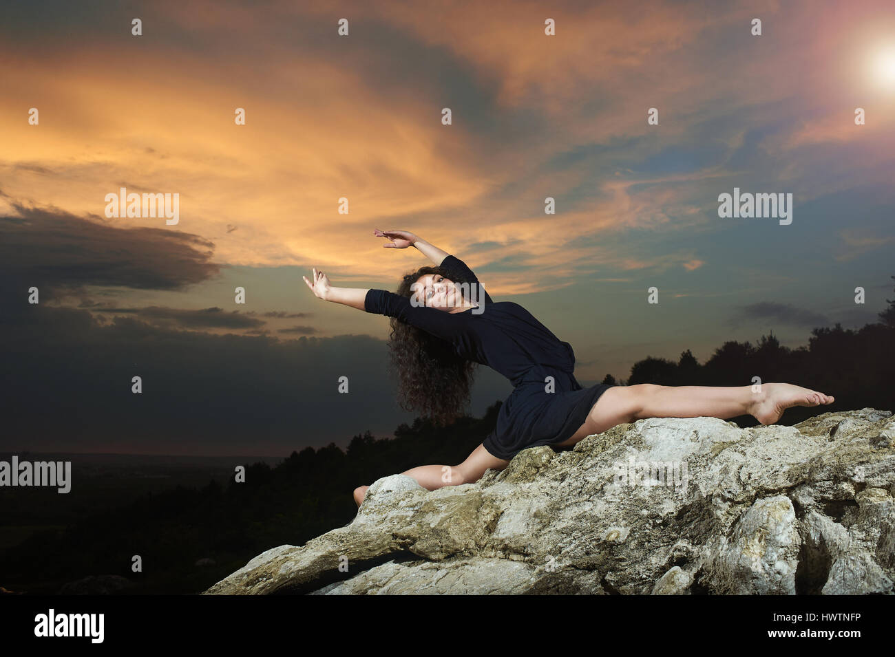 young, curly dancing girl - performs split Stock Photo - Alamy
