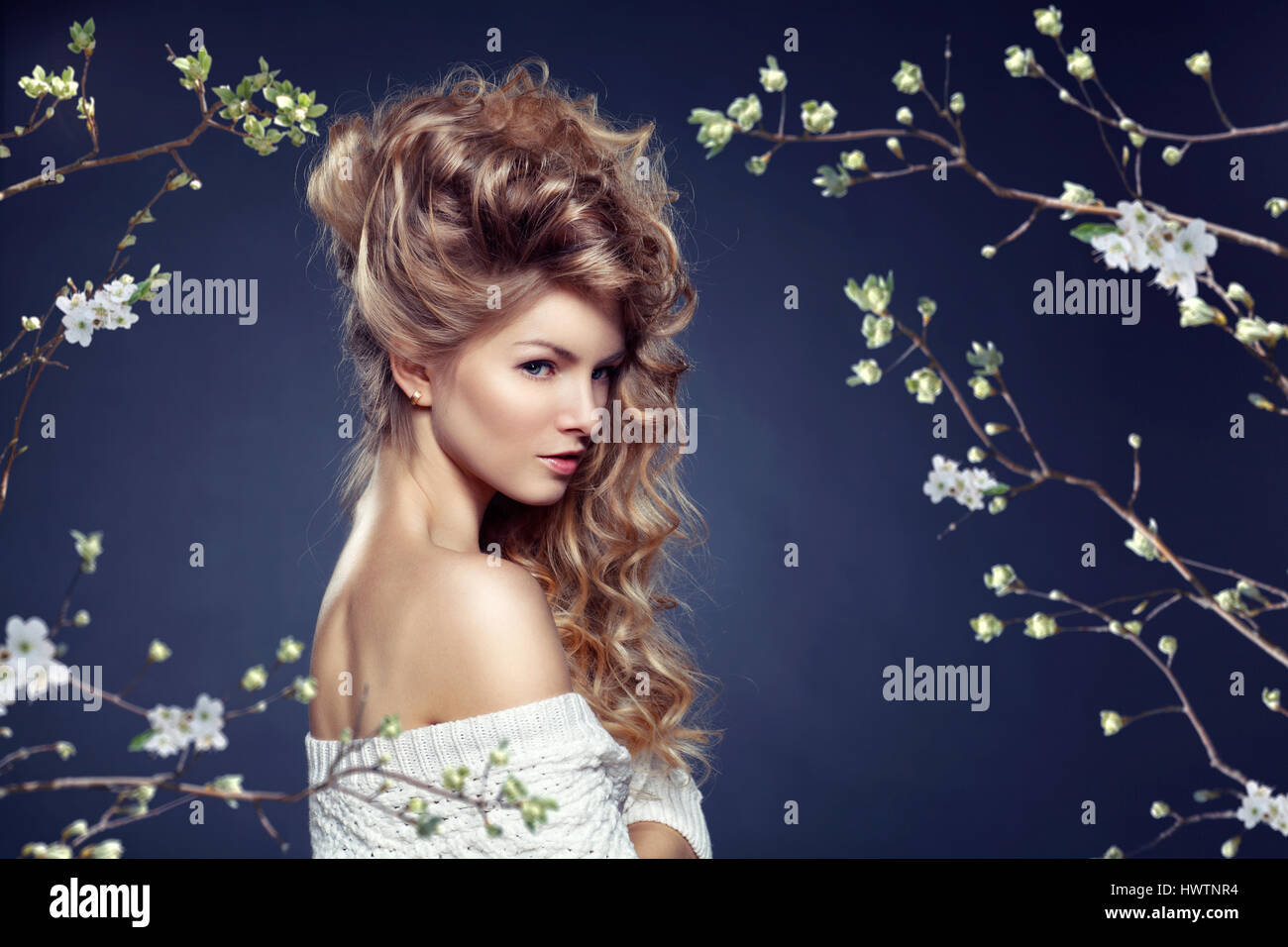 closeup portrait of a beautiful spring girl with flowers. Studio shot ...
