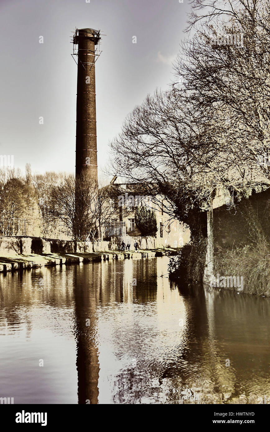 19th century mill chimney on the side of the Leeds Liverpool canal ...